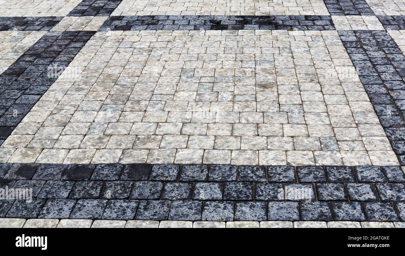 Decorative sidewalk pavement. Tiled floor with gray and black tiles ...