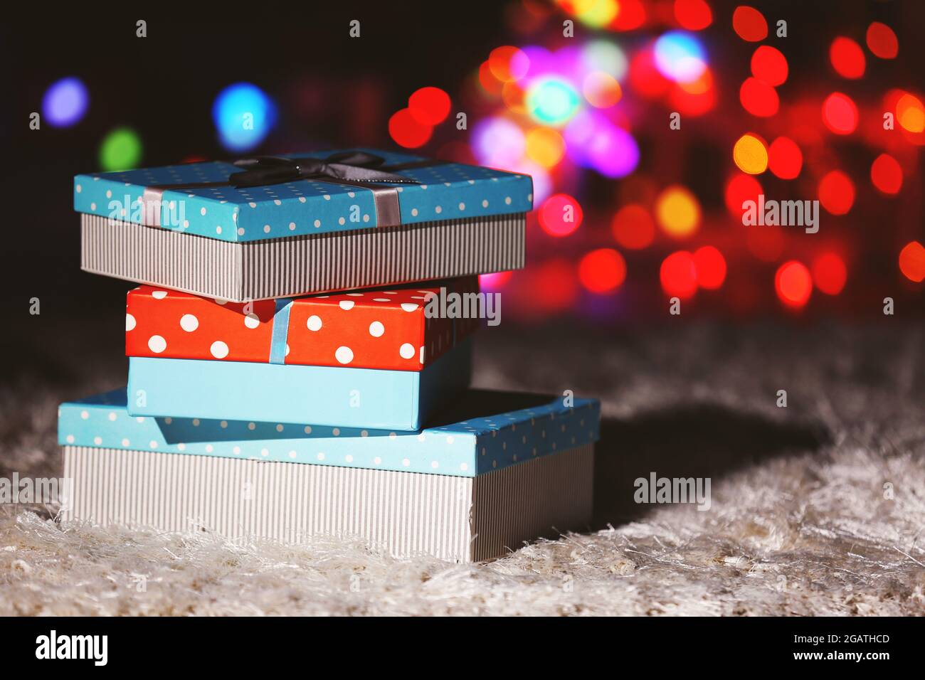 Pile of Christmas gift boxes on the floor, close up Stock Photo - Alamy