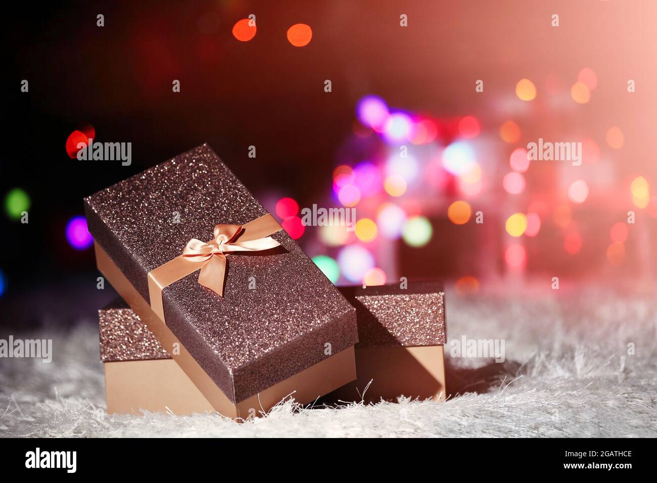 Beautiful gift boxes on the floor, close up Stock Photo - Alamy