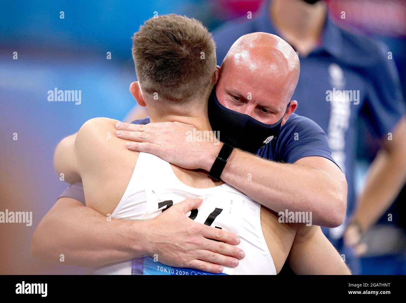 Great Britain's Max Whitlock hugs his coach Scott Hann after winning ...