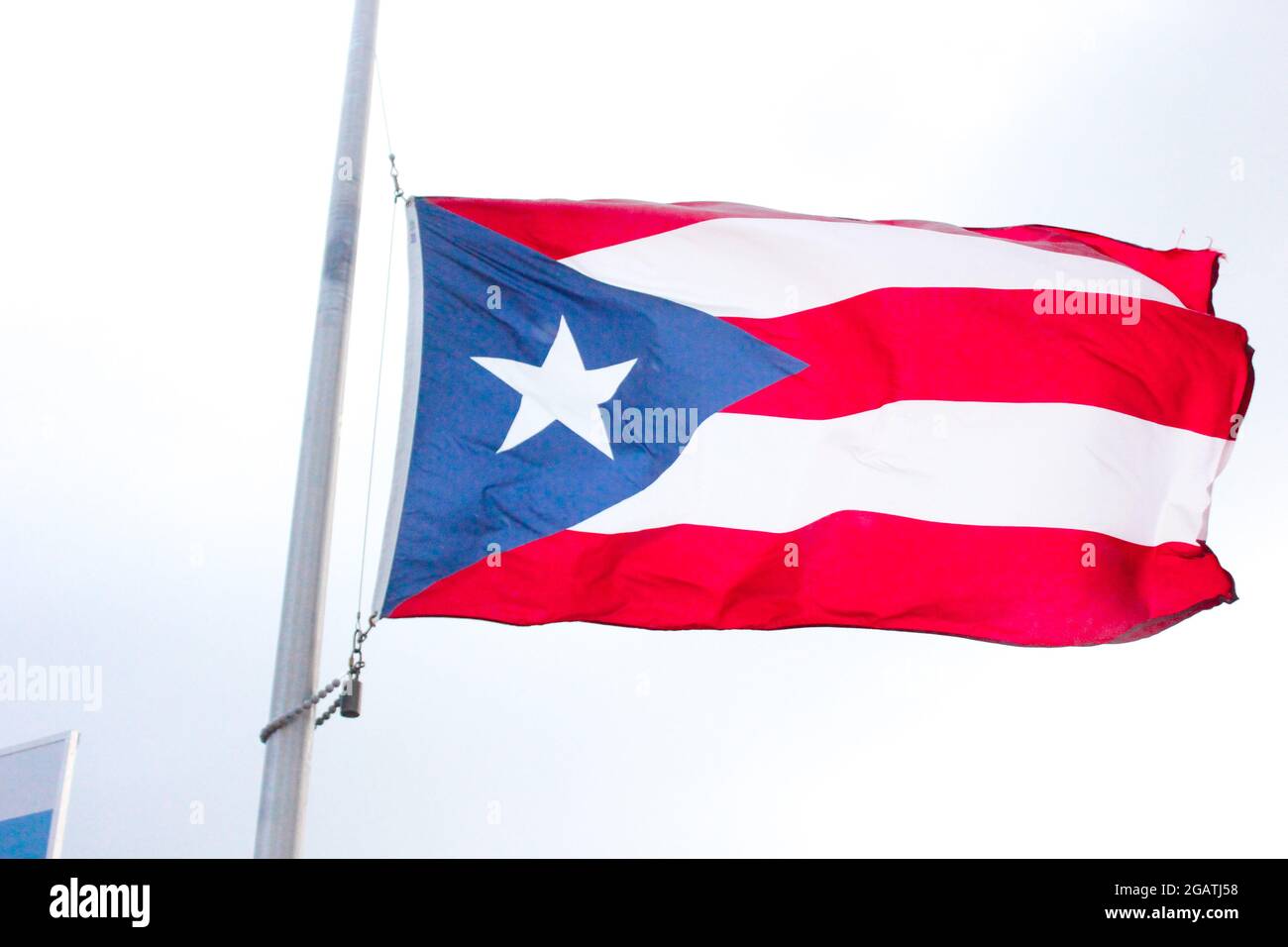 Puerto Rico state flag fly with blue sky in San Juan Stock Photo - Alamy
