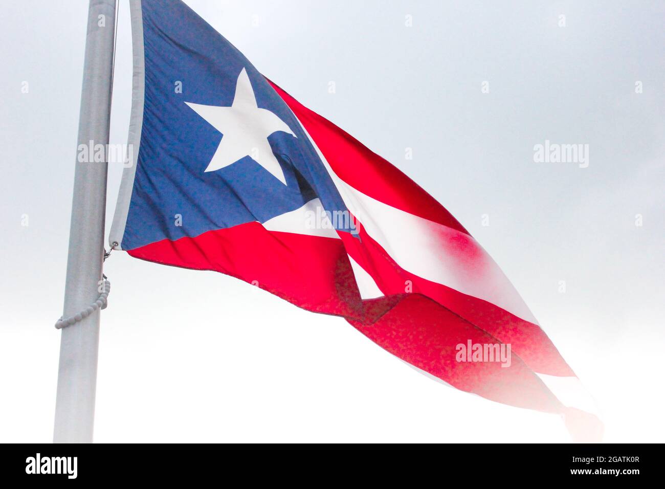 Puerto Rico state flag fly with blue sky in San Juan Stock Photo - Alamy