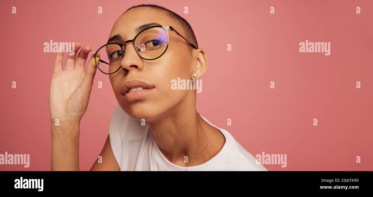Closeup Of A Creative Woman Eyeglasses Looking Away Female With Shaved