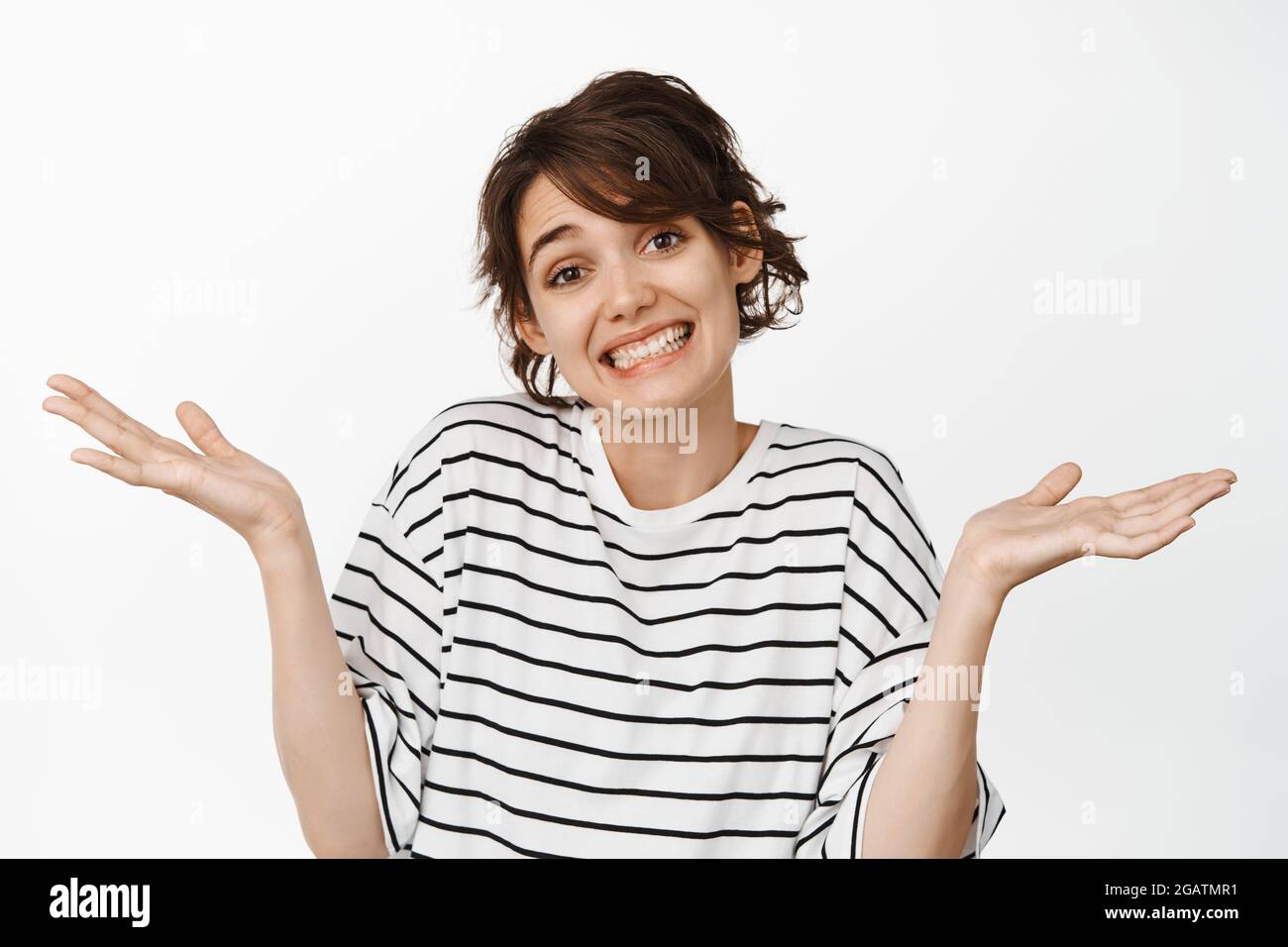 Oops sorry my mistake. Cute awkward woman shrugging shoulders and ...