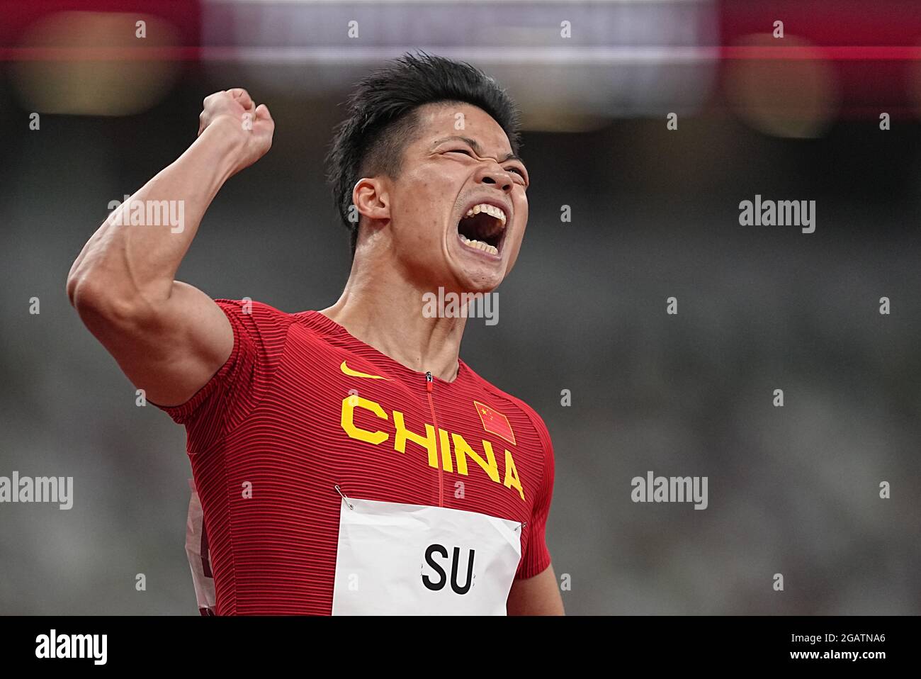 01 August 2021, Japan, Tokio: Athletics: Olympics, 100m, men, preliminary heat, Bingtian Su of ...