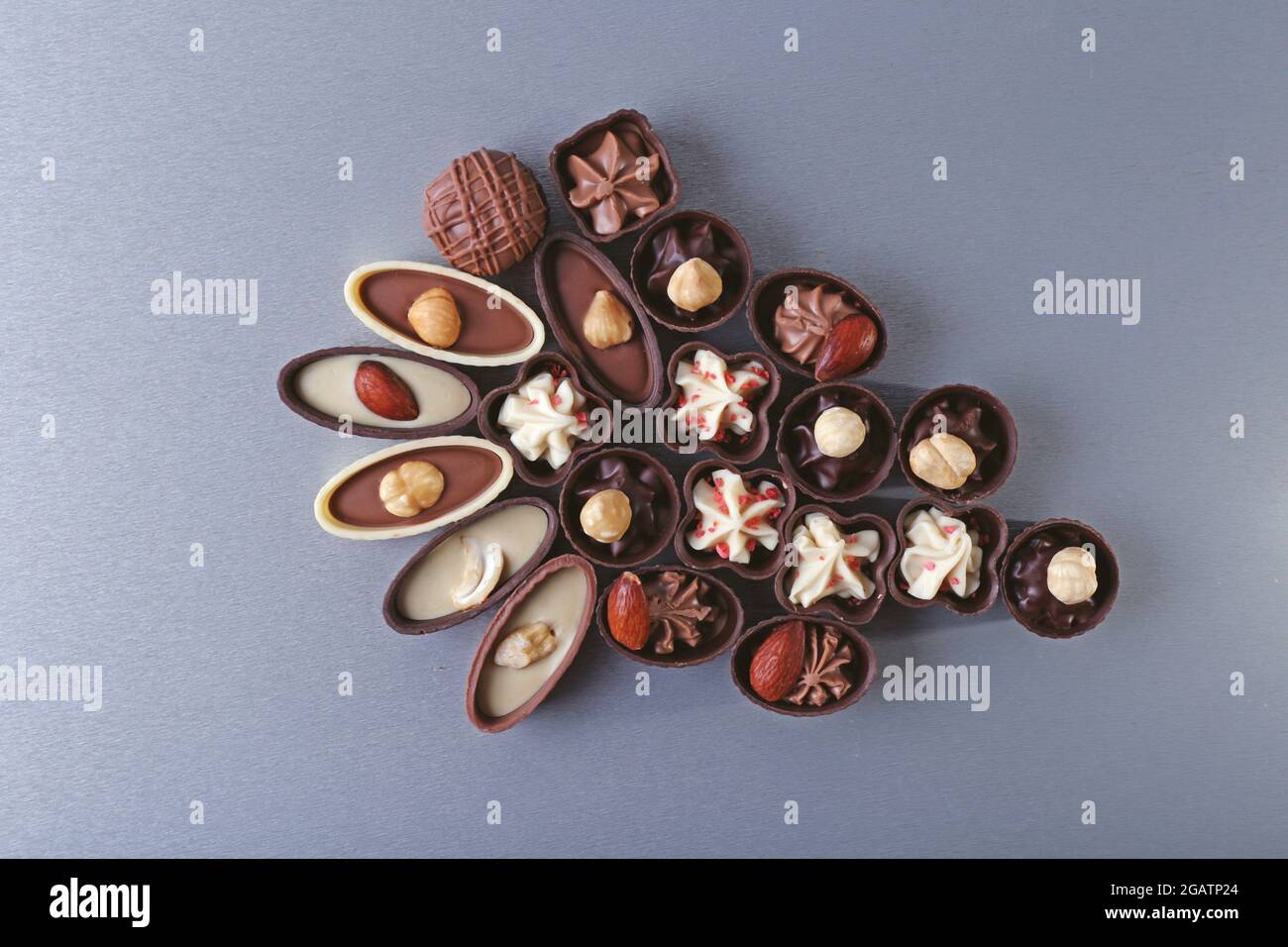 Chocolate sweets on dark grey background Stock Photo - Alamy