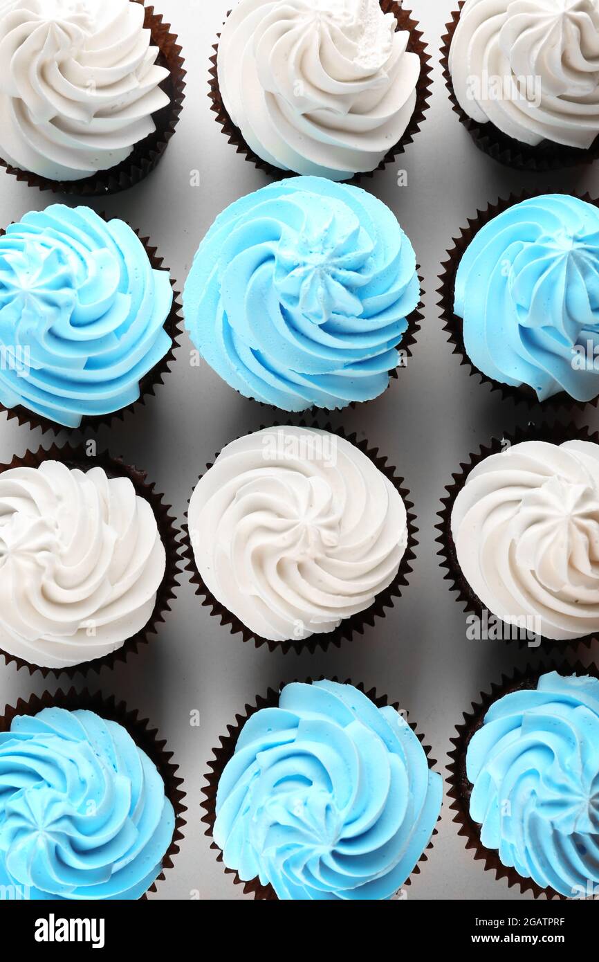 Blue and white delicious cupcakes background Stock Photo - Alamy