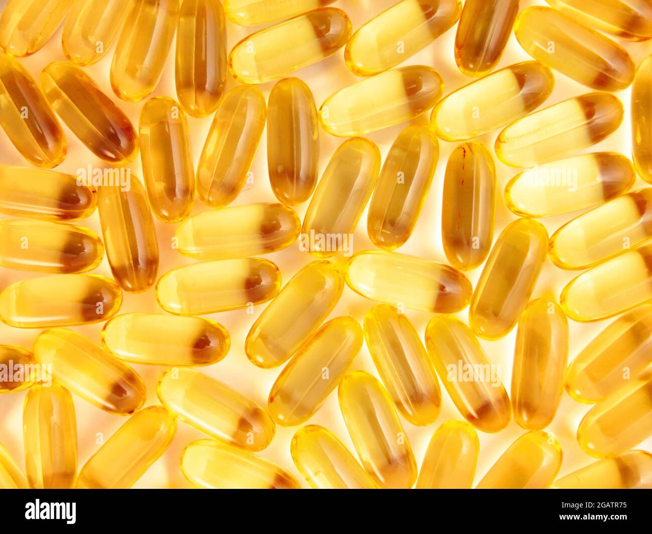 fish oil omega 3 on white background texture Stock Photo - Alamy
