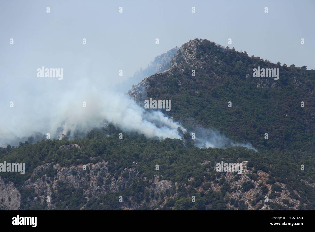 Smoke rises from a forest fire in Marmaris district in Mugla, Turkey ...