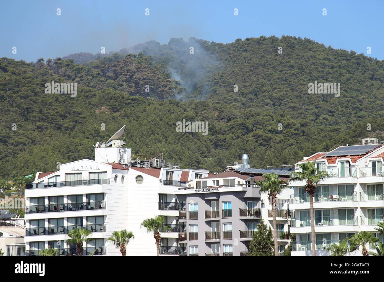Smoke rises from a forest fire in Marmaris district in Mugla, Turkey ...