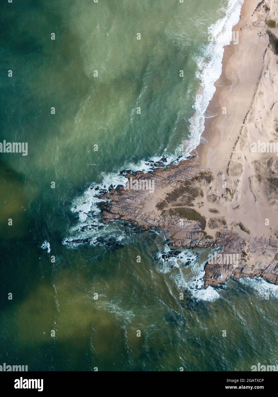 An aerial view of the sea waves washing the sandy shore Stock Photo - Alamy
