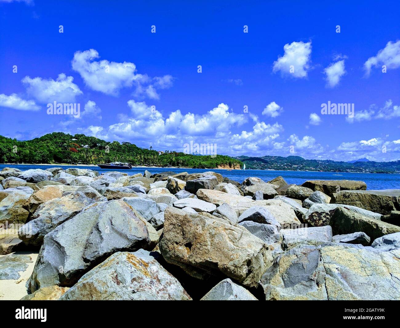 The rocks on the shore of a sea during daytime Stock Photo - Alamy