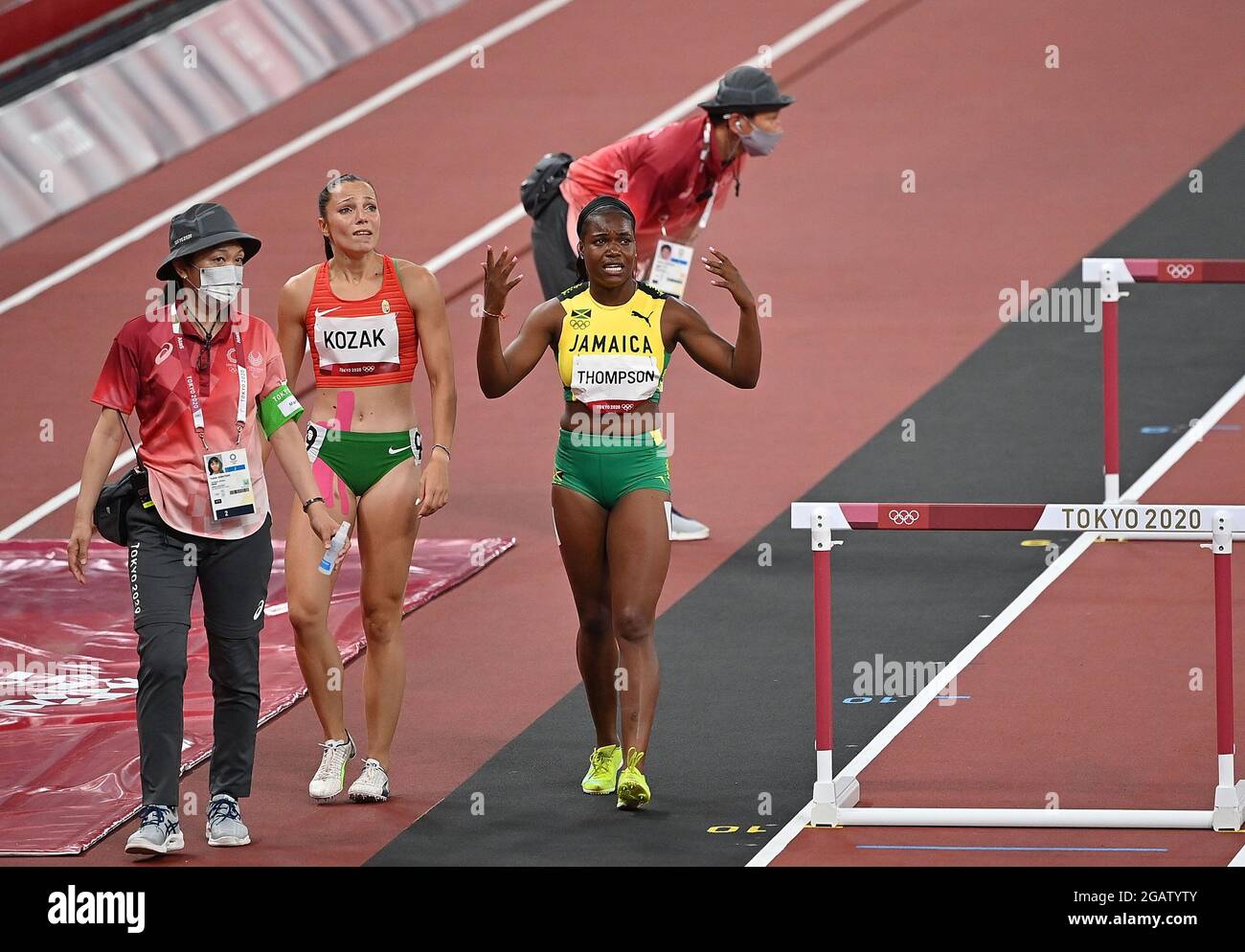 Tokyo, Japan. 1st Aug, 2021. Yanique Thompson of Jamaica (1st R) reacts ...