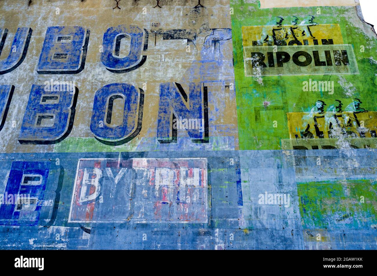 Vintage advertising on the side of an old building in Brittany, France ...