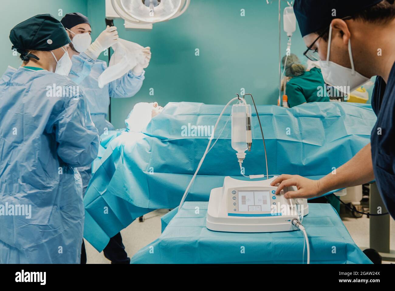 Surgeon team preparing patient in operating room at private clinic ...