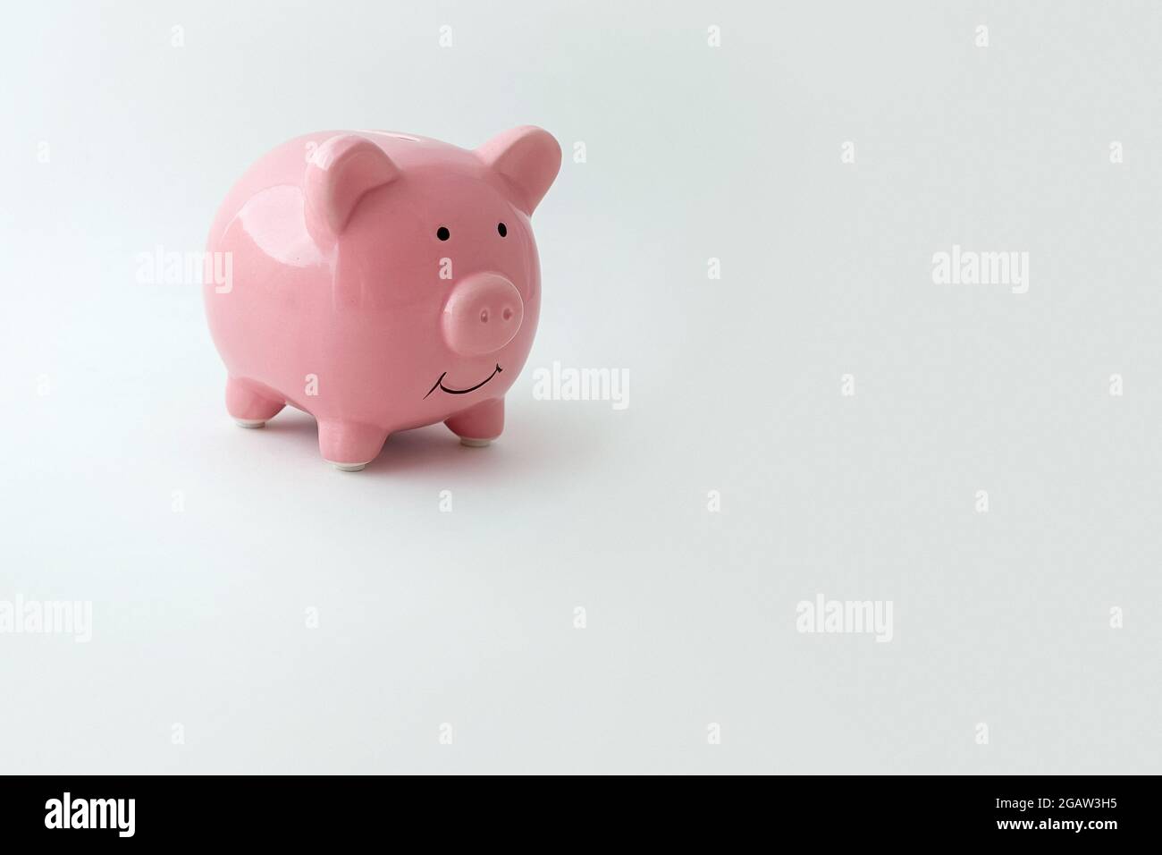 Piggy bank in the shape of a pig on an isolated white background Stock ...