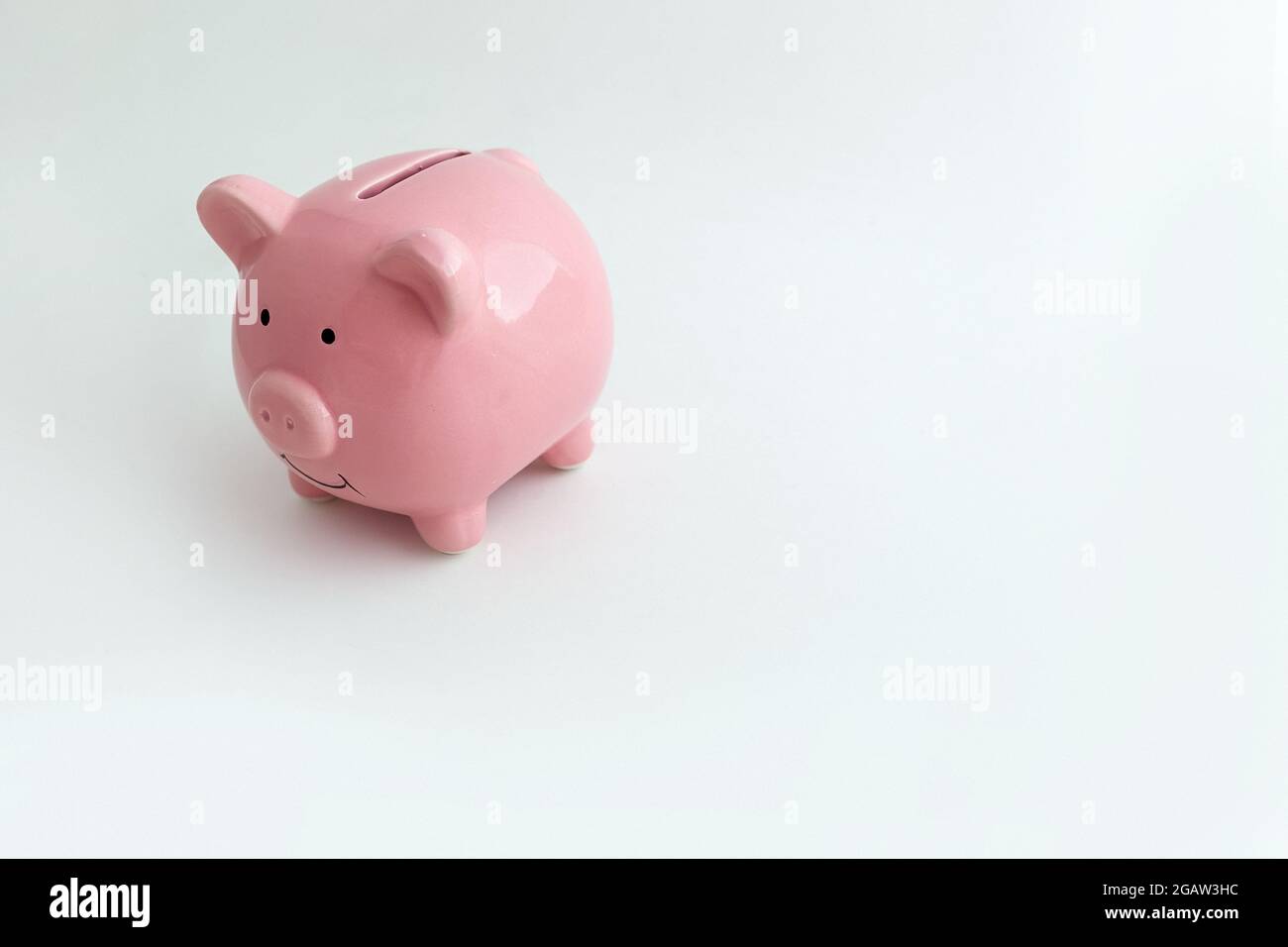 Piggy bank in the shape of a pig on an isolated white background Stock ...