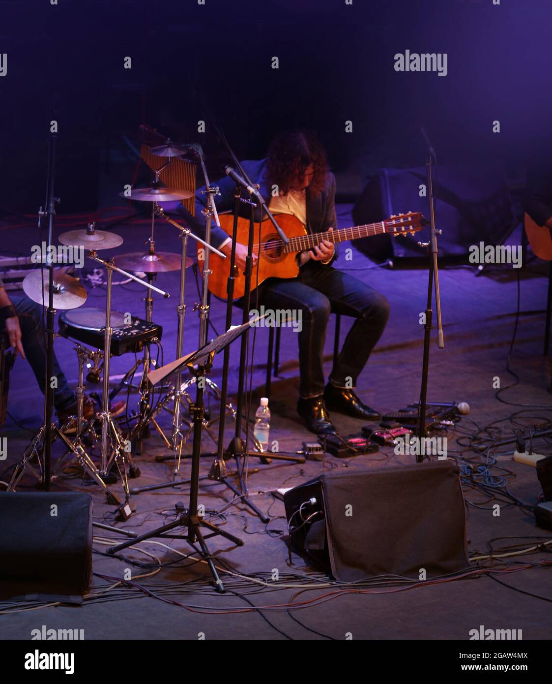 Musical group playing at the stage Stock Photo - Alamy