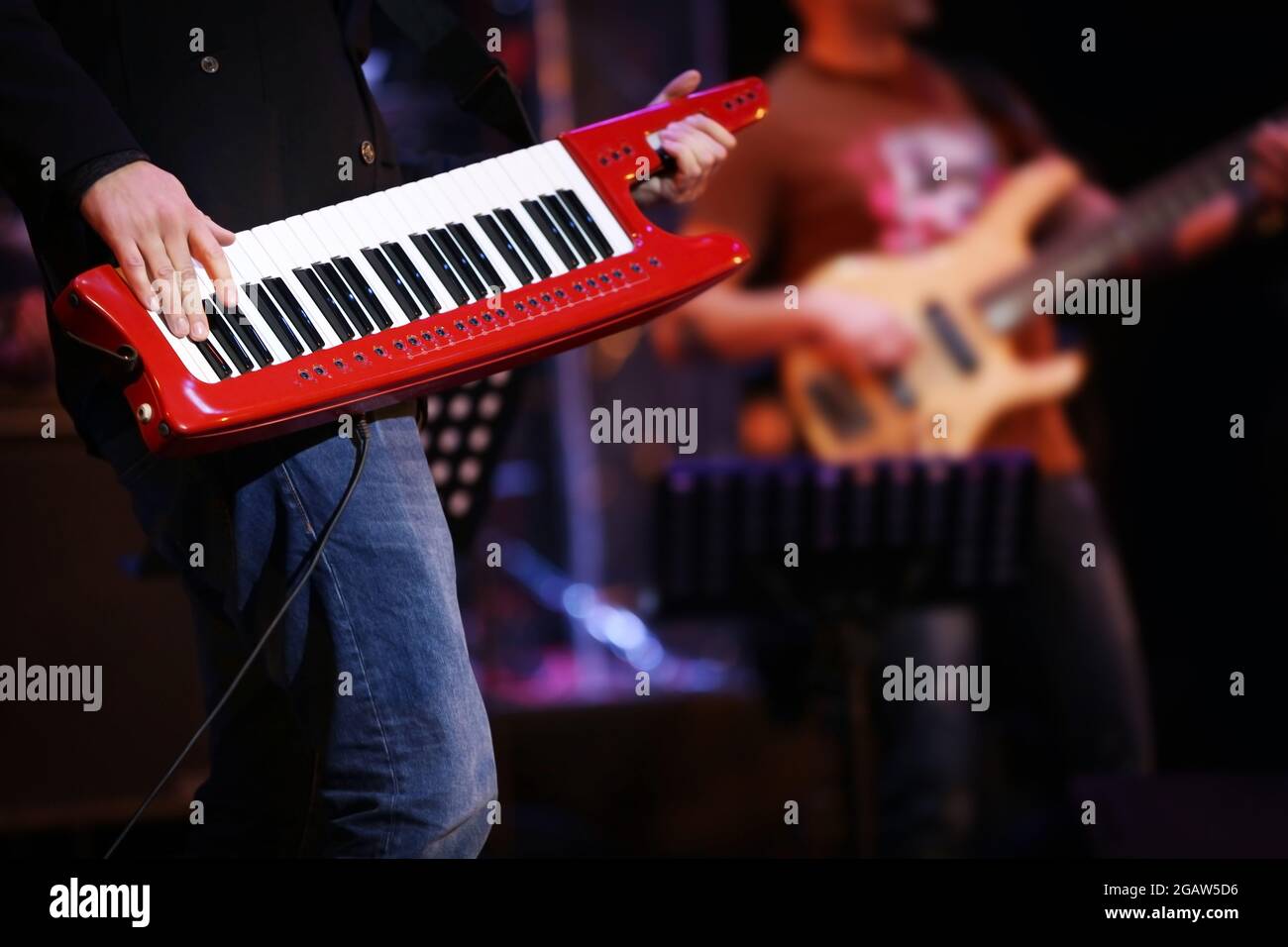 Musician playing synthesizer at concert Stock Photo - Alamy