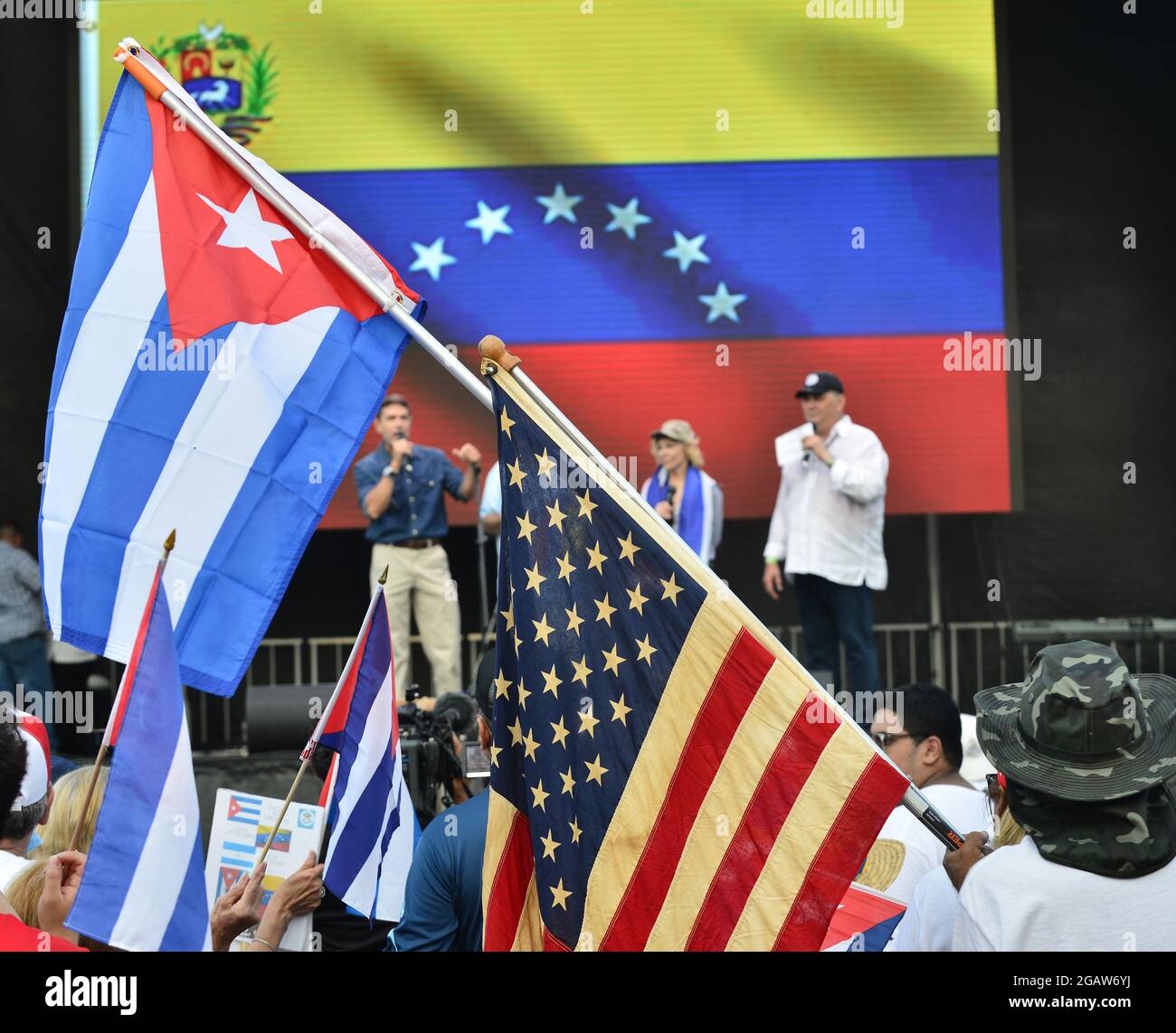 MIAMI, FLORIDA, USA - JULY 31: A man reacts as he holds Cuban and U.S ...