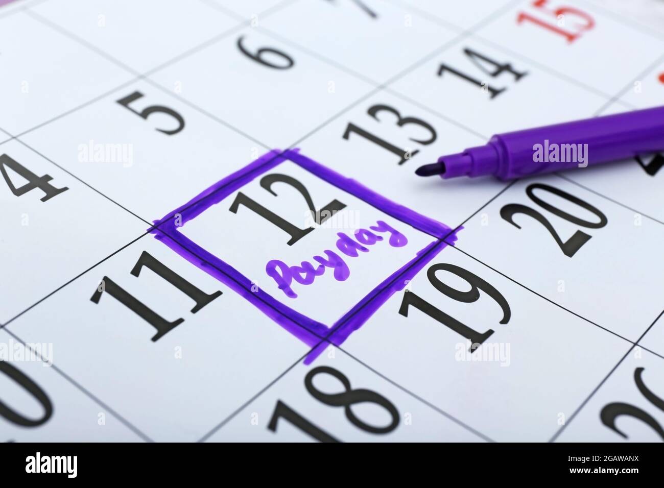 Payday concept. Calendar with purple felt pen background. Date in frame ...