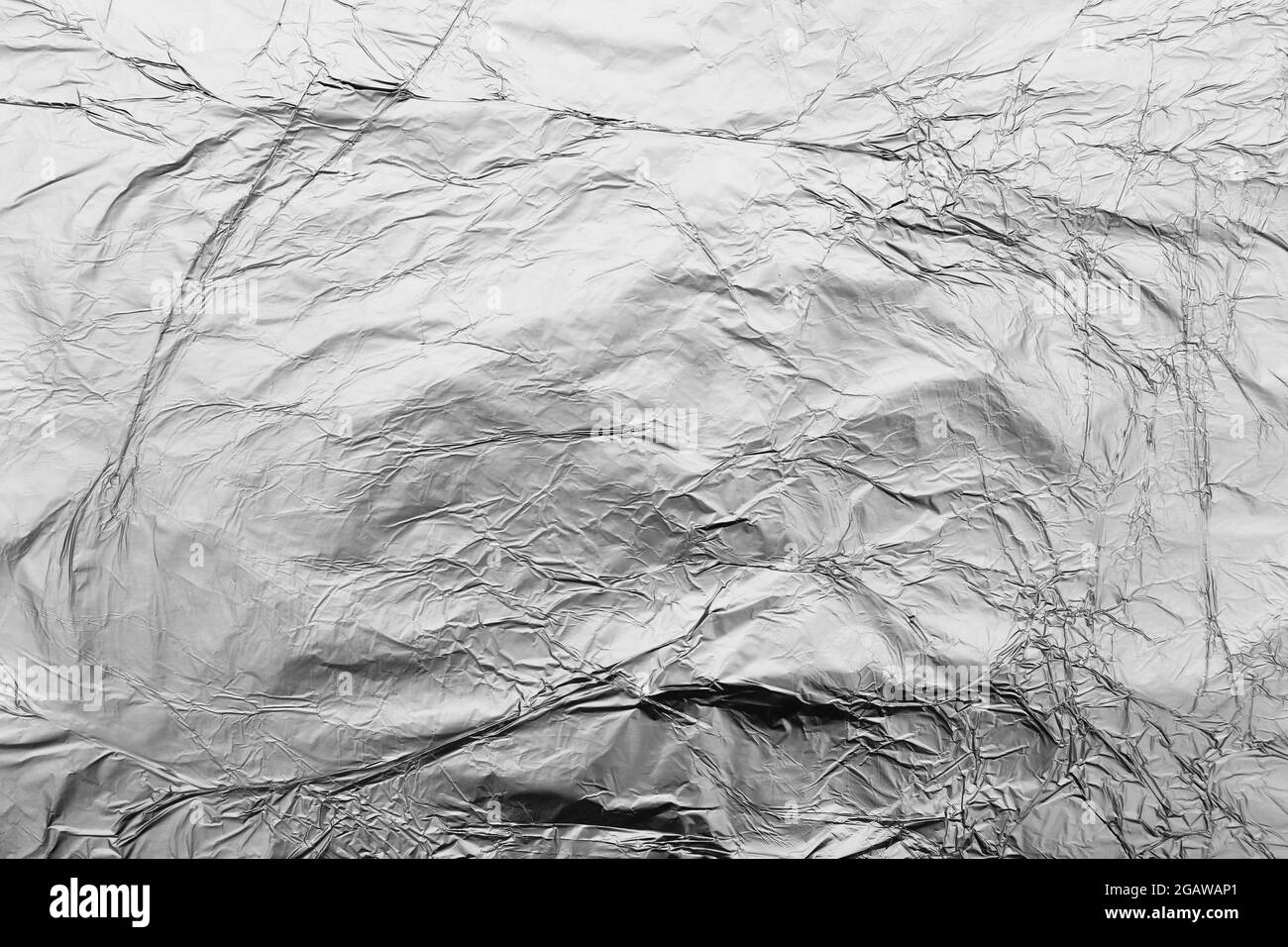 Silver crumpled foil background Stock Photo - Alamy