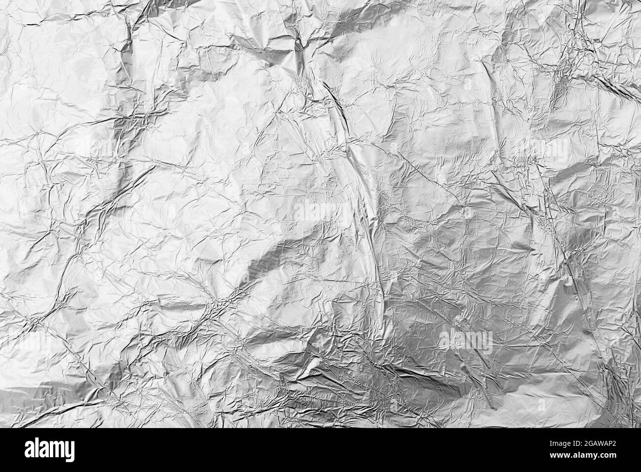 Silver crumpled foil background Stock Photo - Alamy
