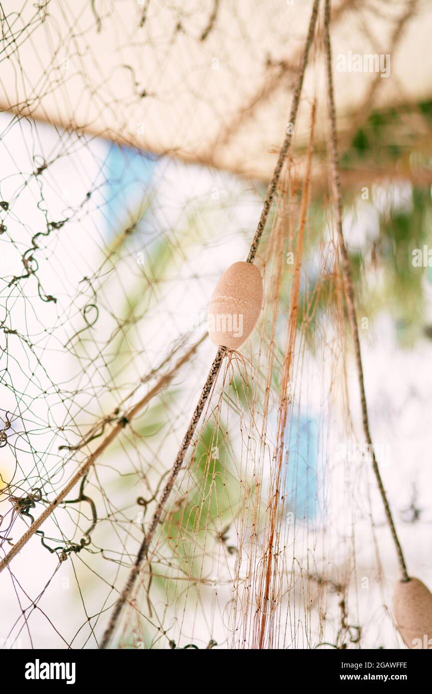 Fishing net with weights on the ropes Stock Photo - Alamy