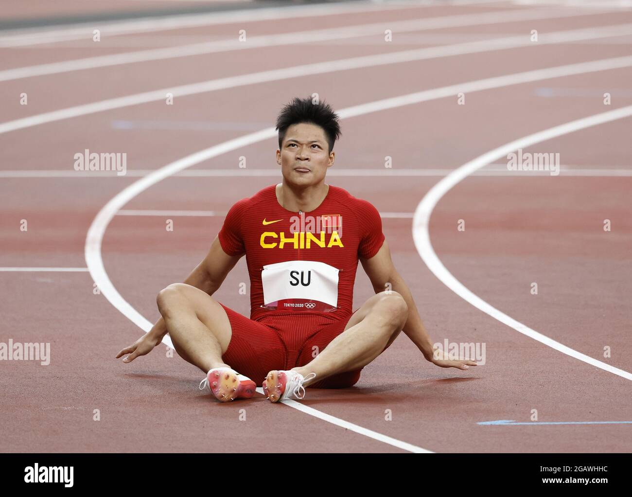 Tokyo, Japan. 01st Aug, 2021. China's Bingtian Su looks to the results scoreboard after ...