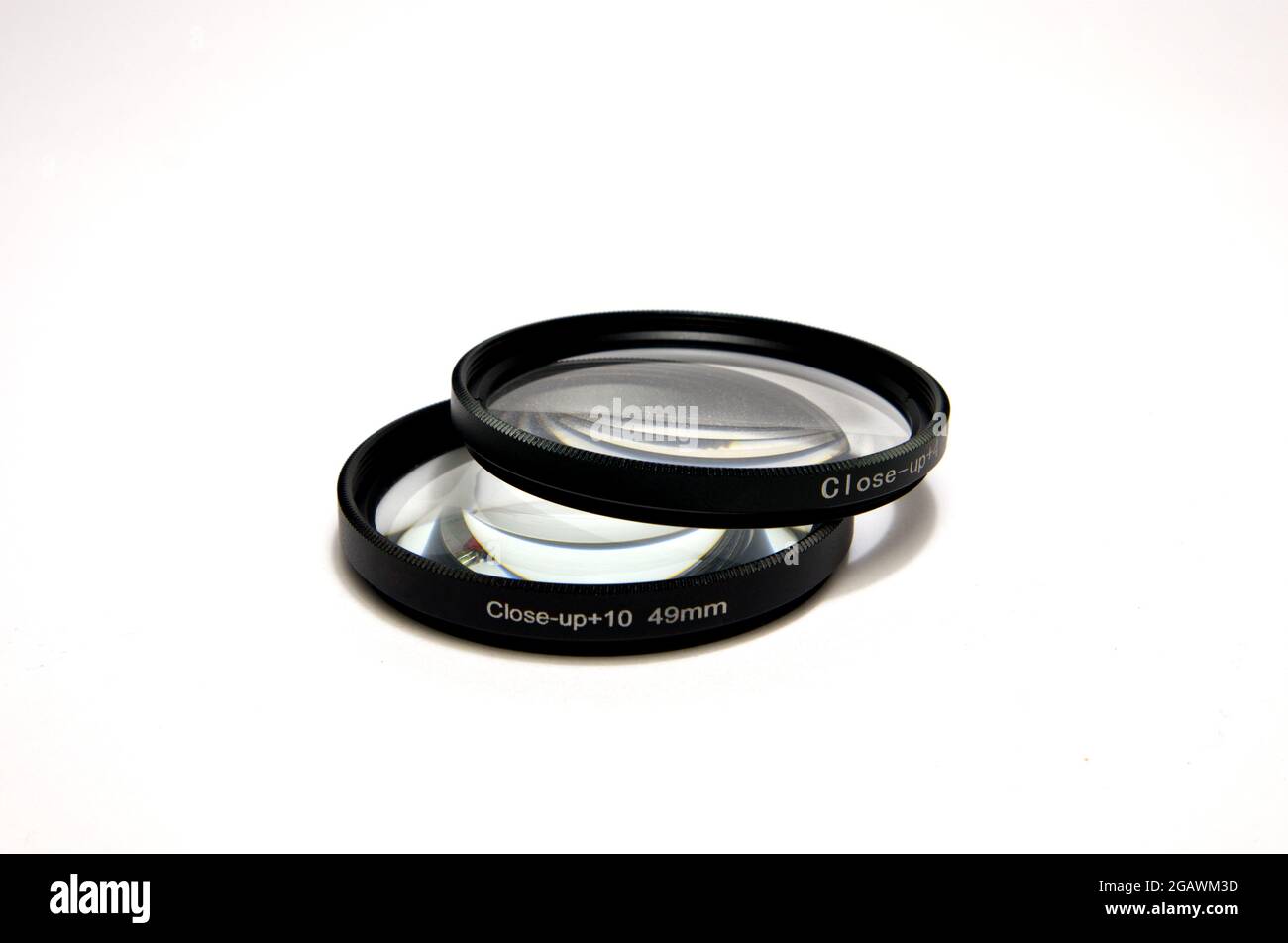 Macro Close-Up Filter Lens,+10, +4, 49mm for dslr camera isolated on ...