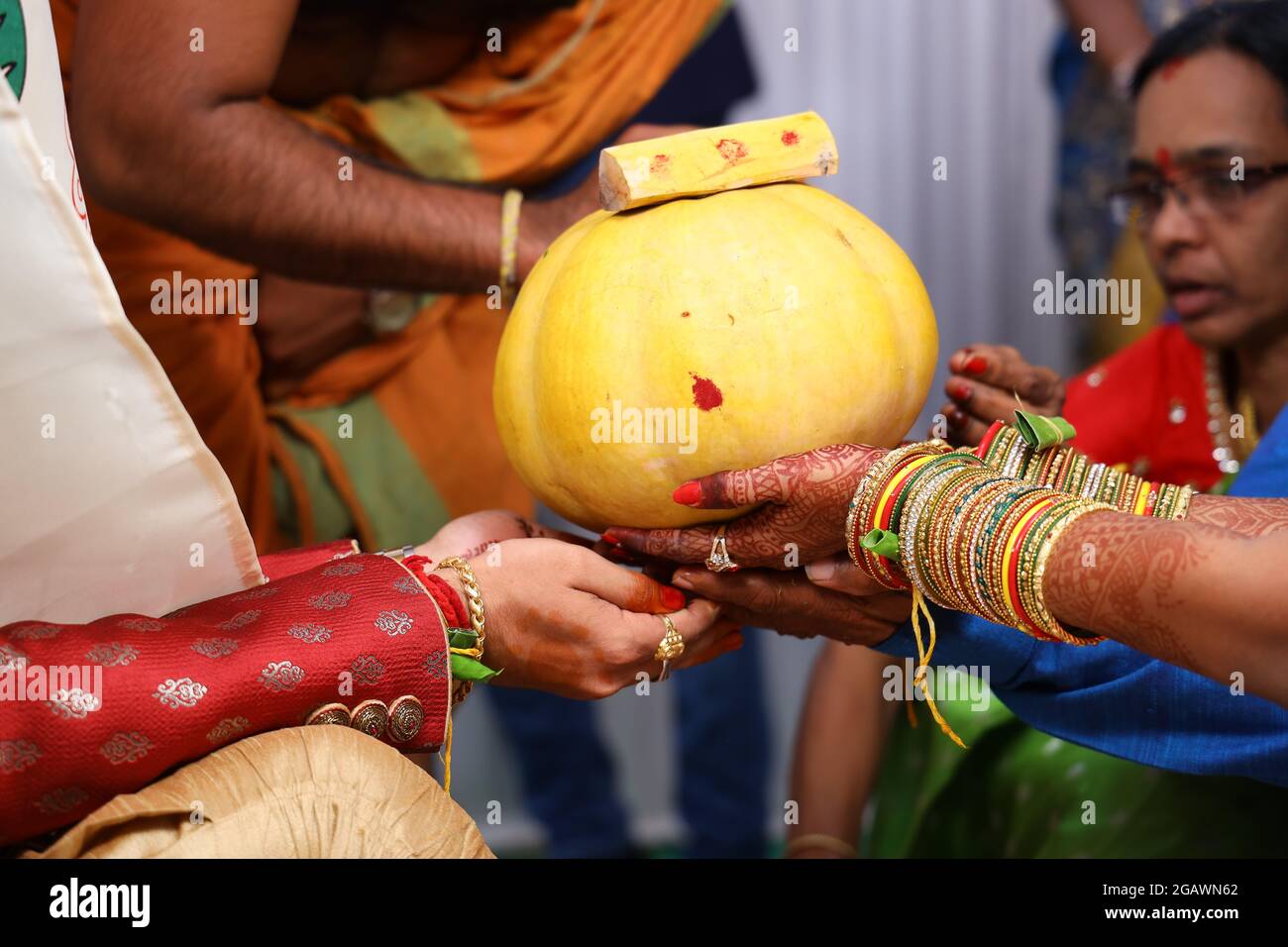 hands exchange with pumpkin at event Stock Photo - Alamy