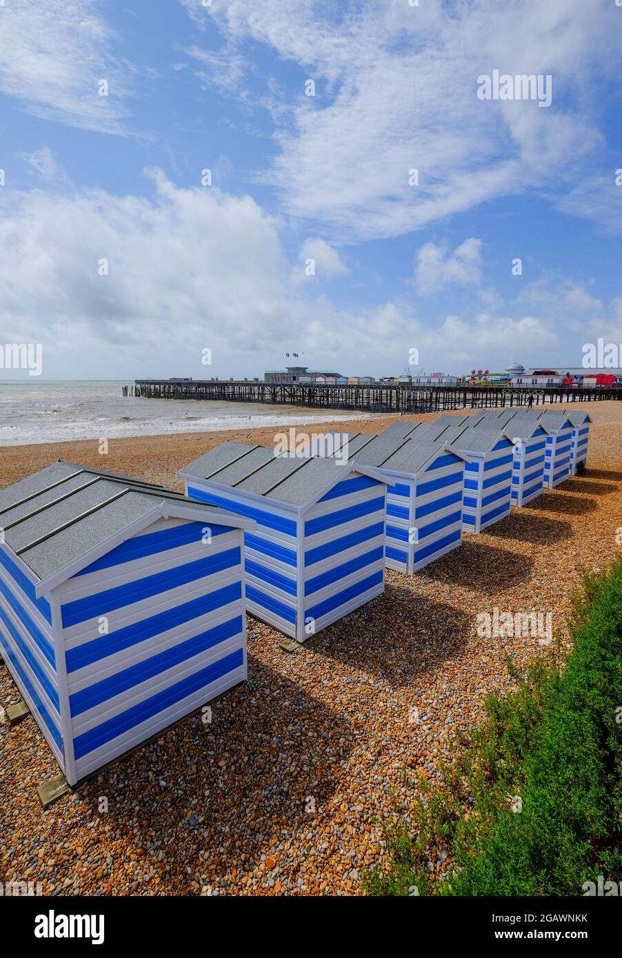 Hastings Pier and beach huts on Hastlings Beach, Hastling, East Sussex ...