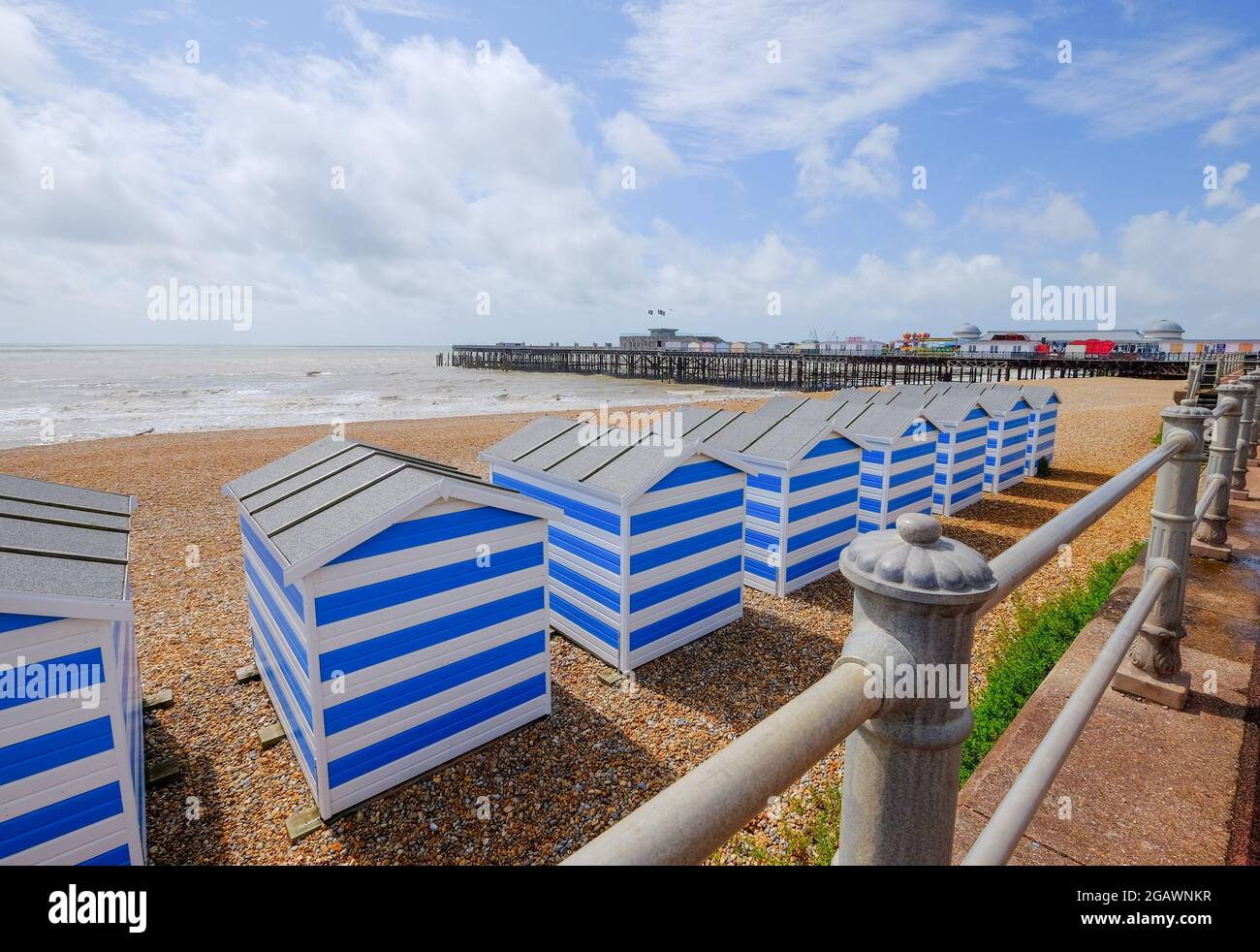 Hastings Pier and beach huts on Hastlings Beach, Hastling, East Sussex ...