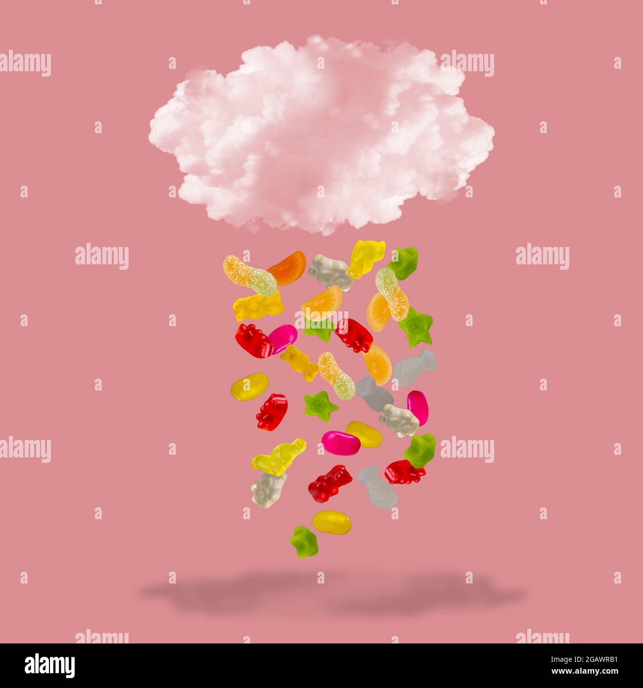 Gummy candies falling from a fluffy cloud Stock Photo - Alamy