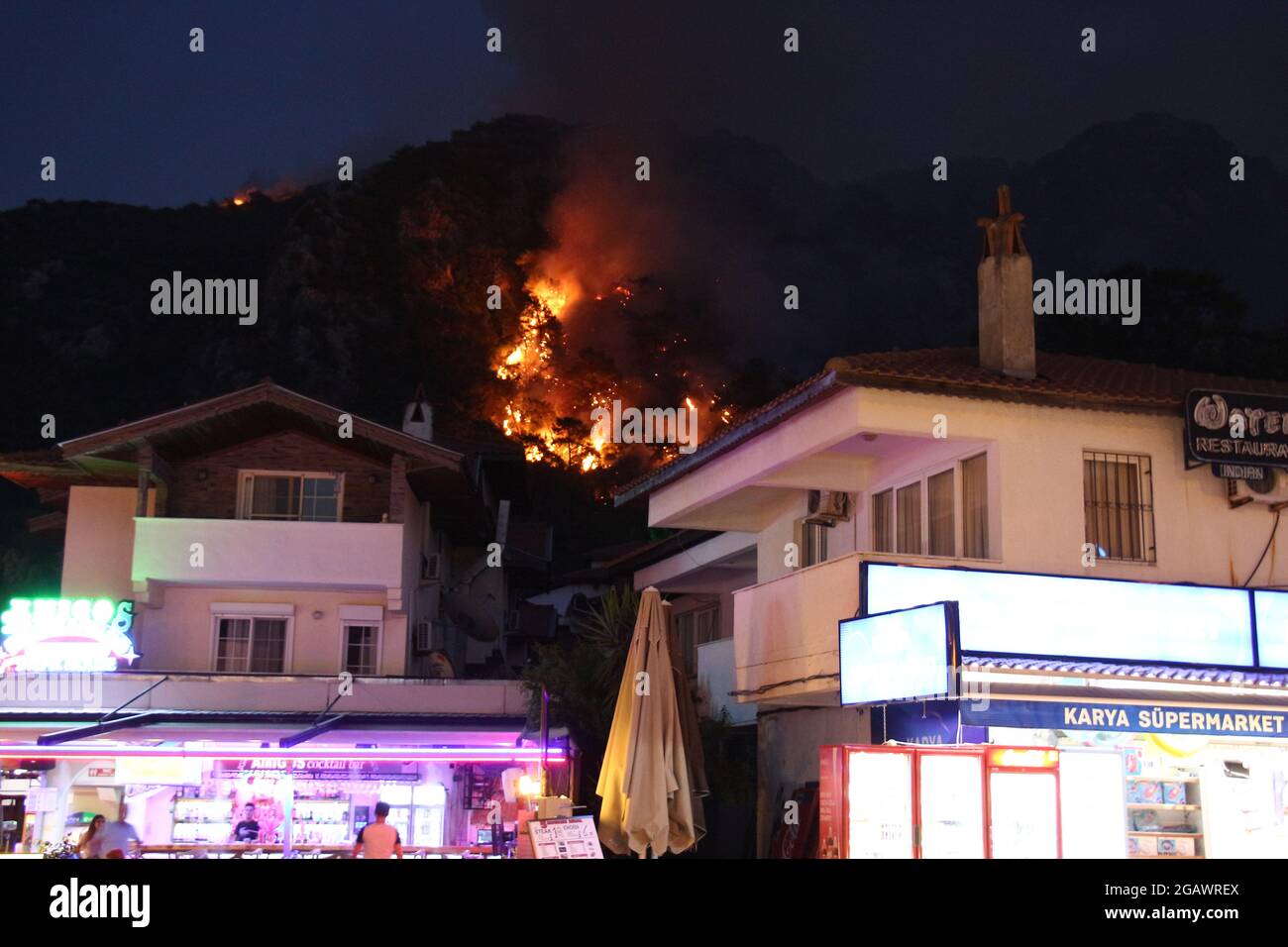 Smoke and flames rise from a forest fire in Marmaris district in Mugla ...