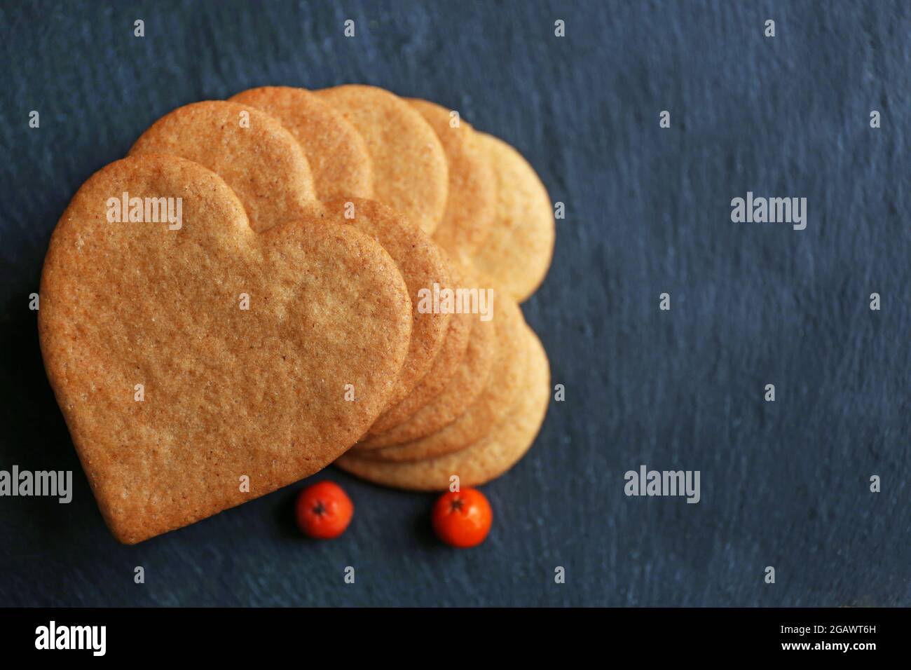 Heart shaped biscuits and ash berries on dark grey background Stock ...