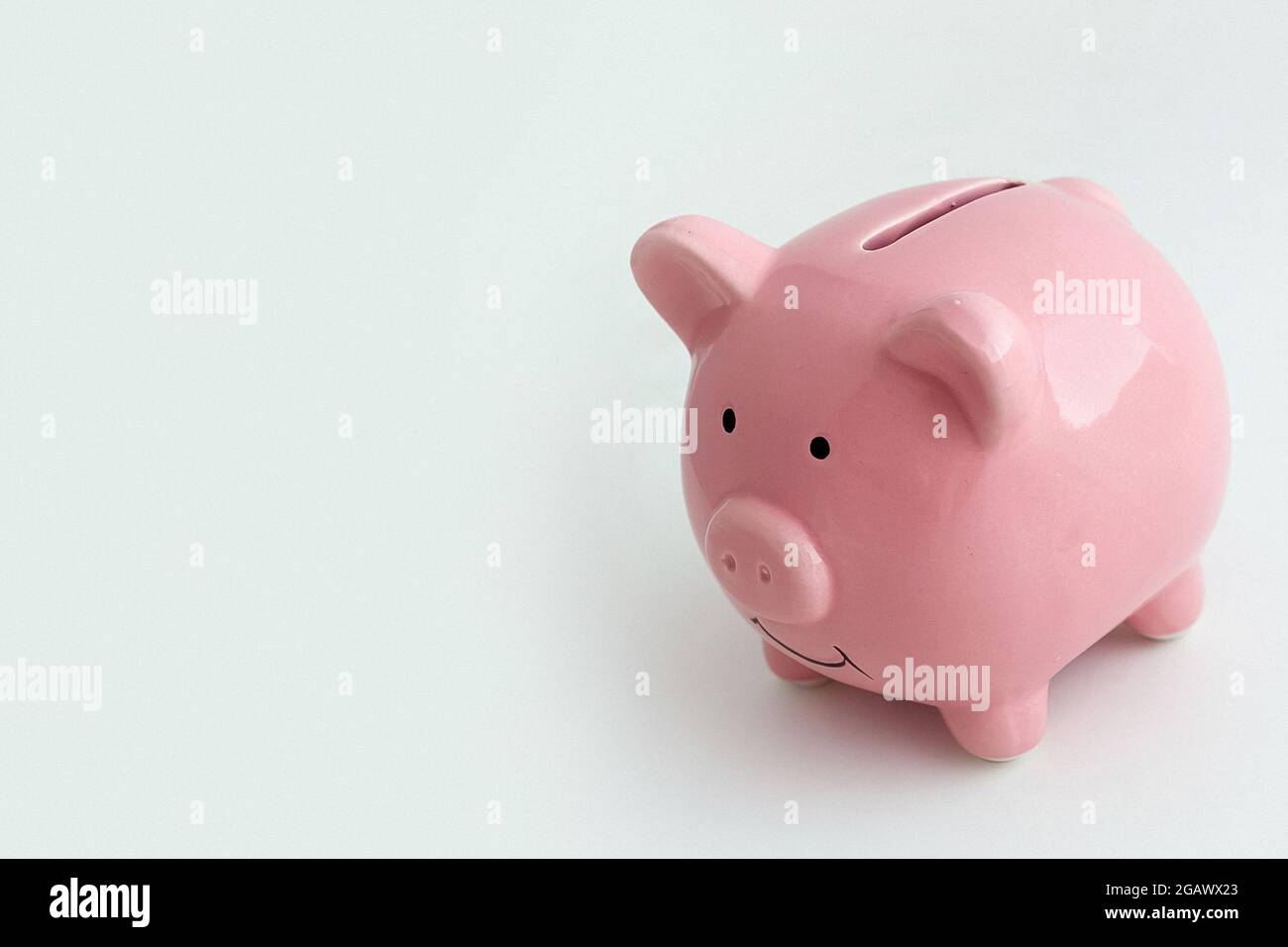 panorama Piggy bank in the shape of a pig on an isolated white ...