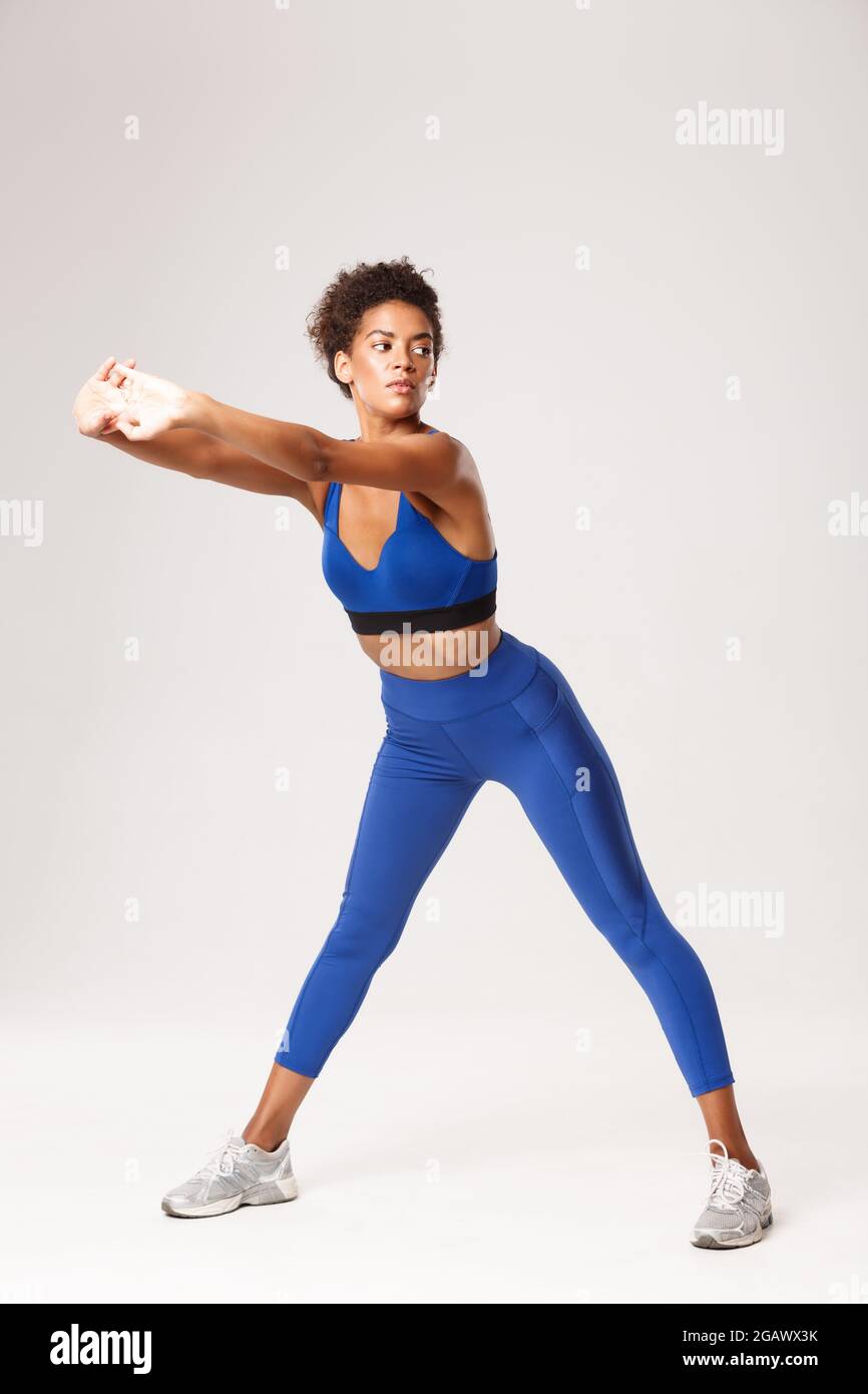 Full length of attractive african-american woman with fit body, wearing ...