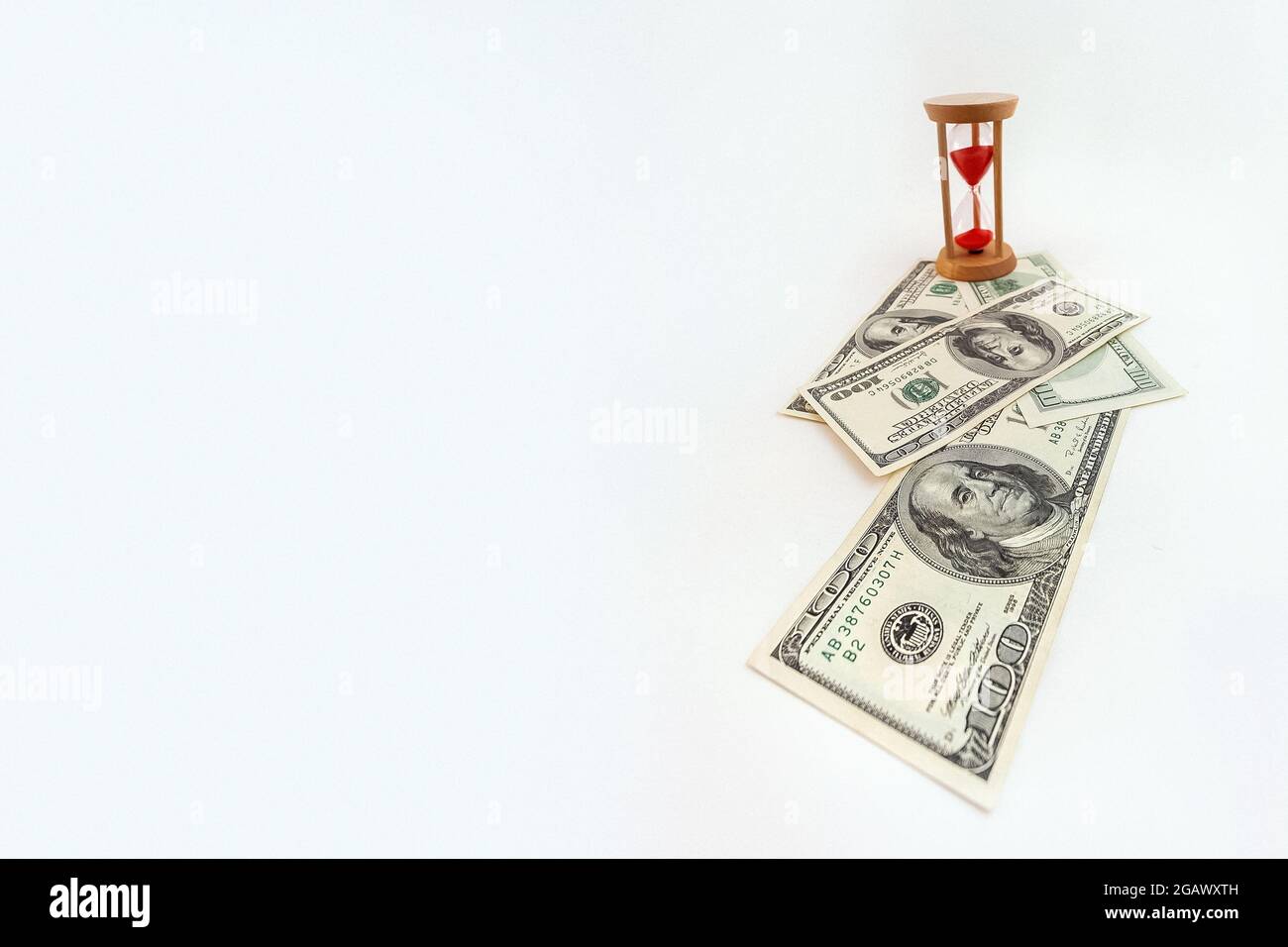 panorama 100 dollar bill with hourglass on white isolated background ...