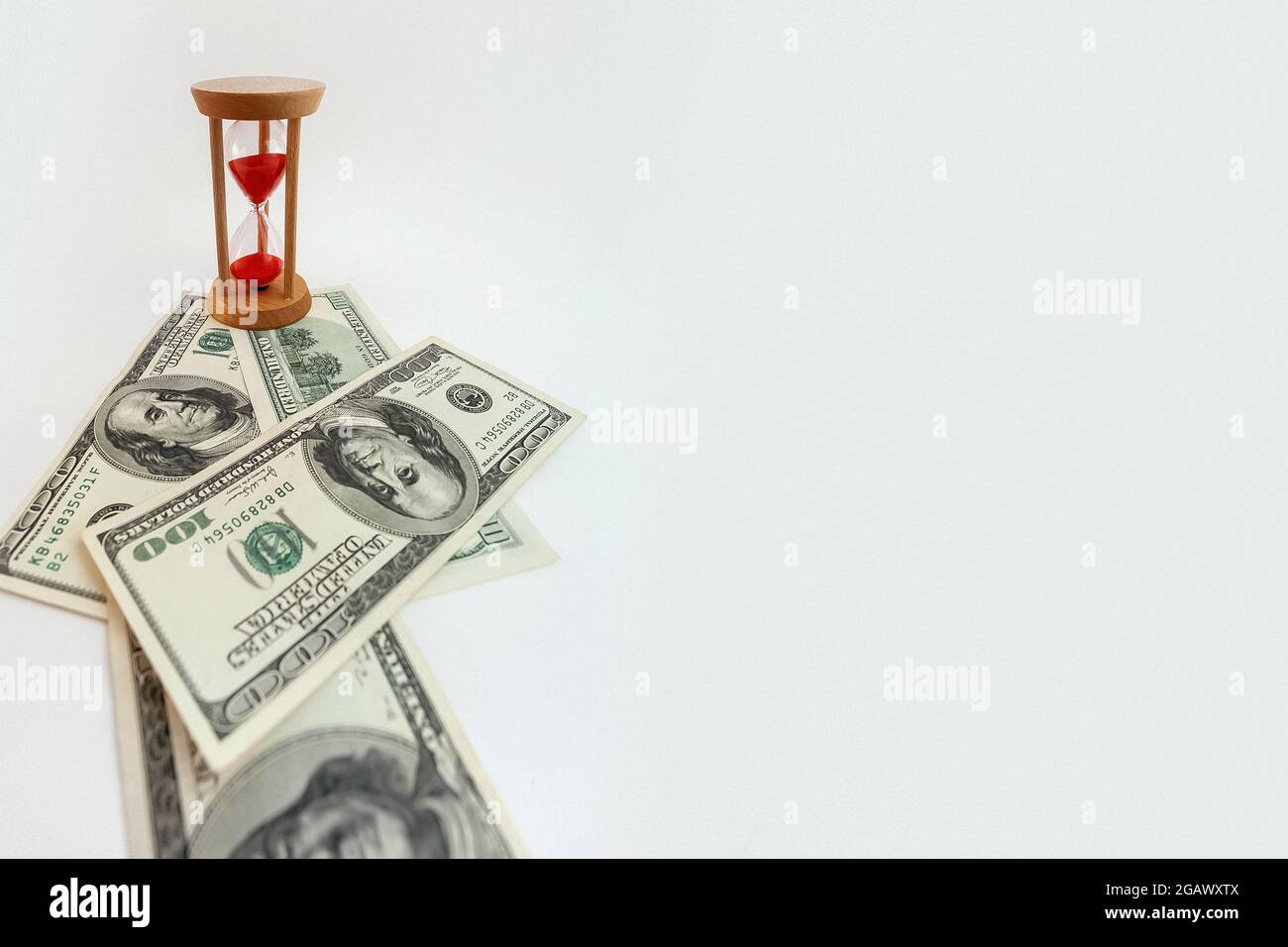 panorama 100 dollar bill with hourglass on white isolated background ...