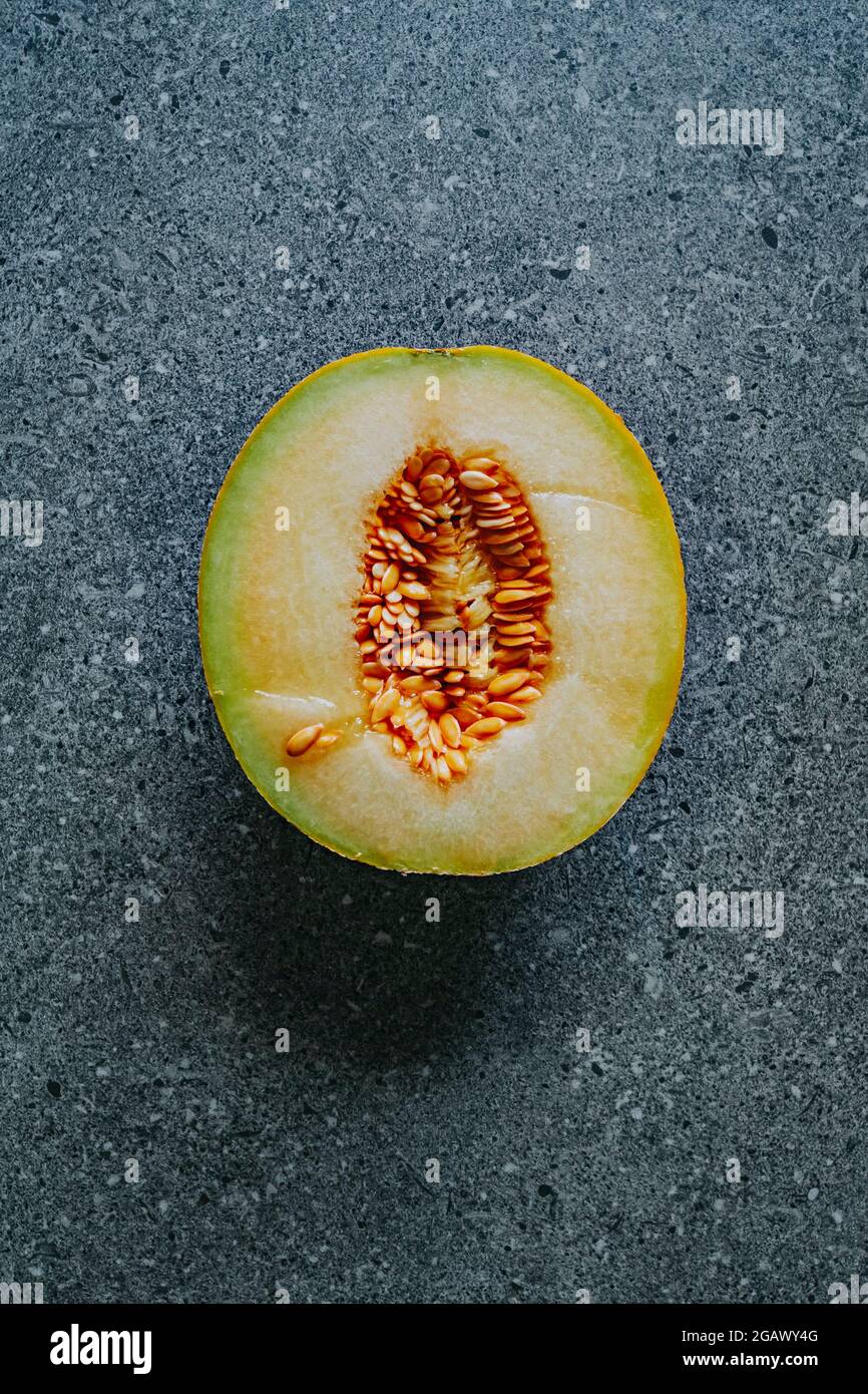 Ogen Melon, Halved on Plain Background with Copyspace, Room for Text ...