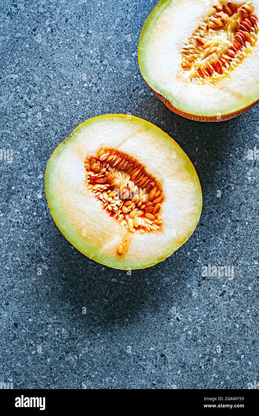Ogen Melon, Halved on Plain Background with Copyspace, Room for Text ...