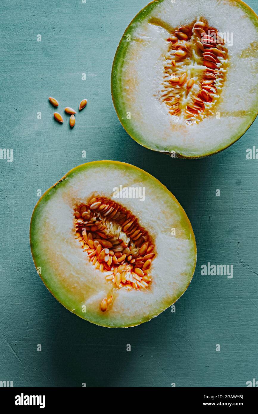 Ogen Melon, Halved on Plain Background with Copyspace, Room for Text ...