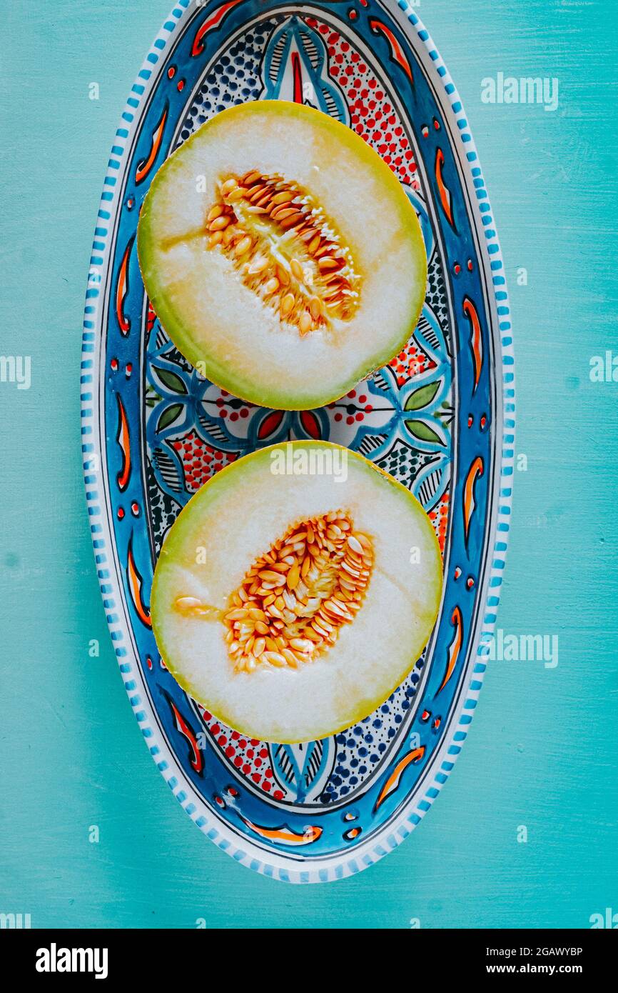 Ogen Melon, Halved on Plain Background with Copyspace, Room for Text ...