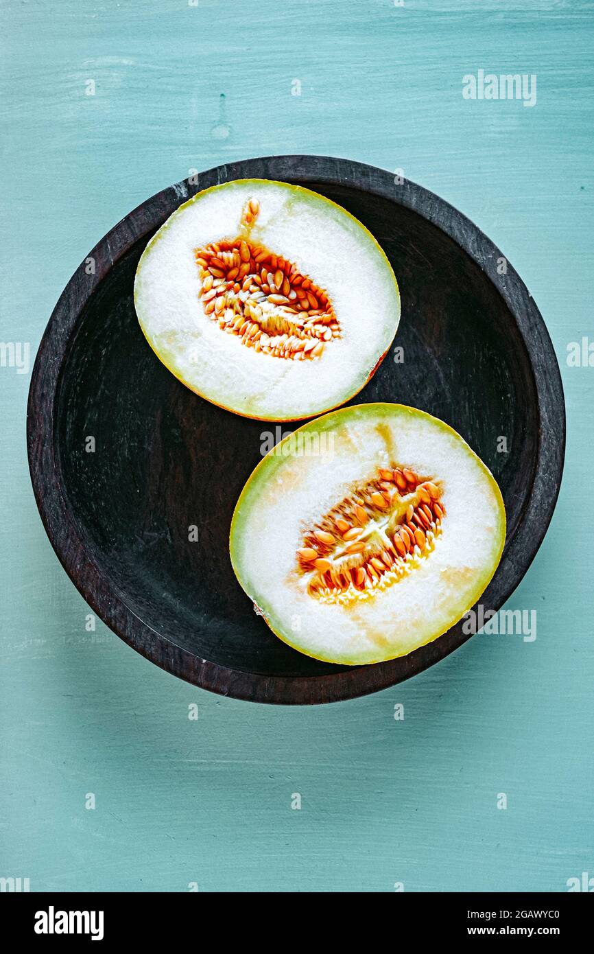 Ogen Melon, Halved on Plain Background with Copyspace, Room for Text ...