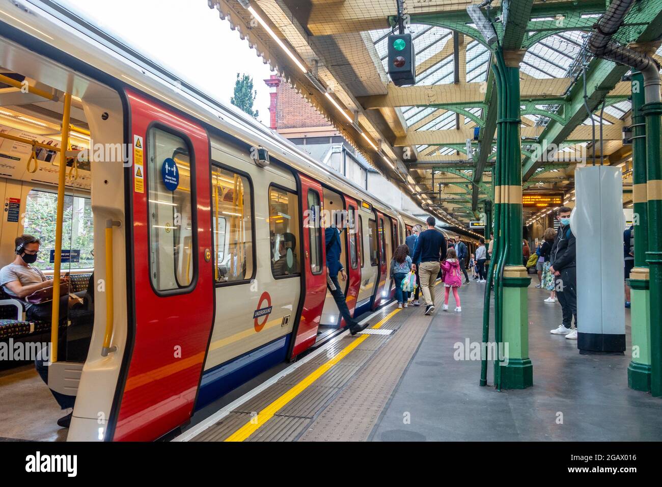A London Underground train sits at the platform at South Kensington ...