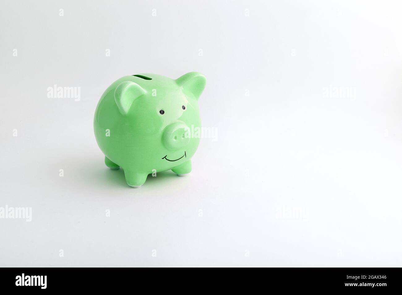 Piggy bank in the shape of a pig on an isolated white background Stock ...