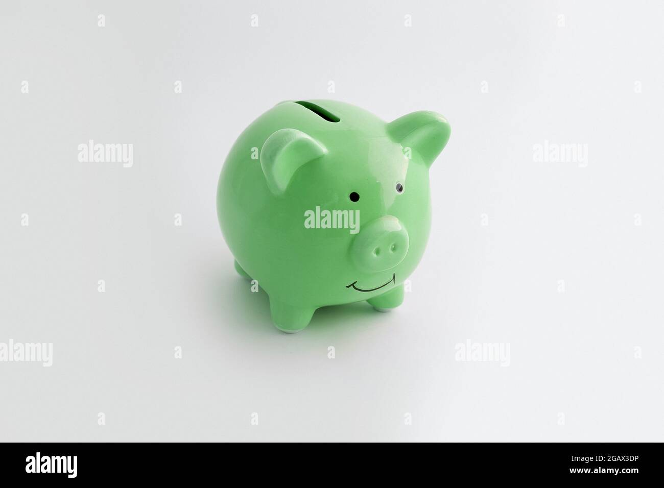 Piggy bank in the shape of a pig on an isolated white background Stock ...