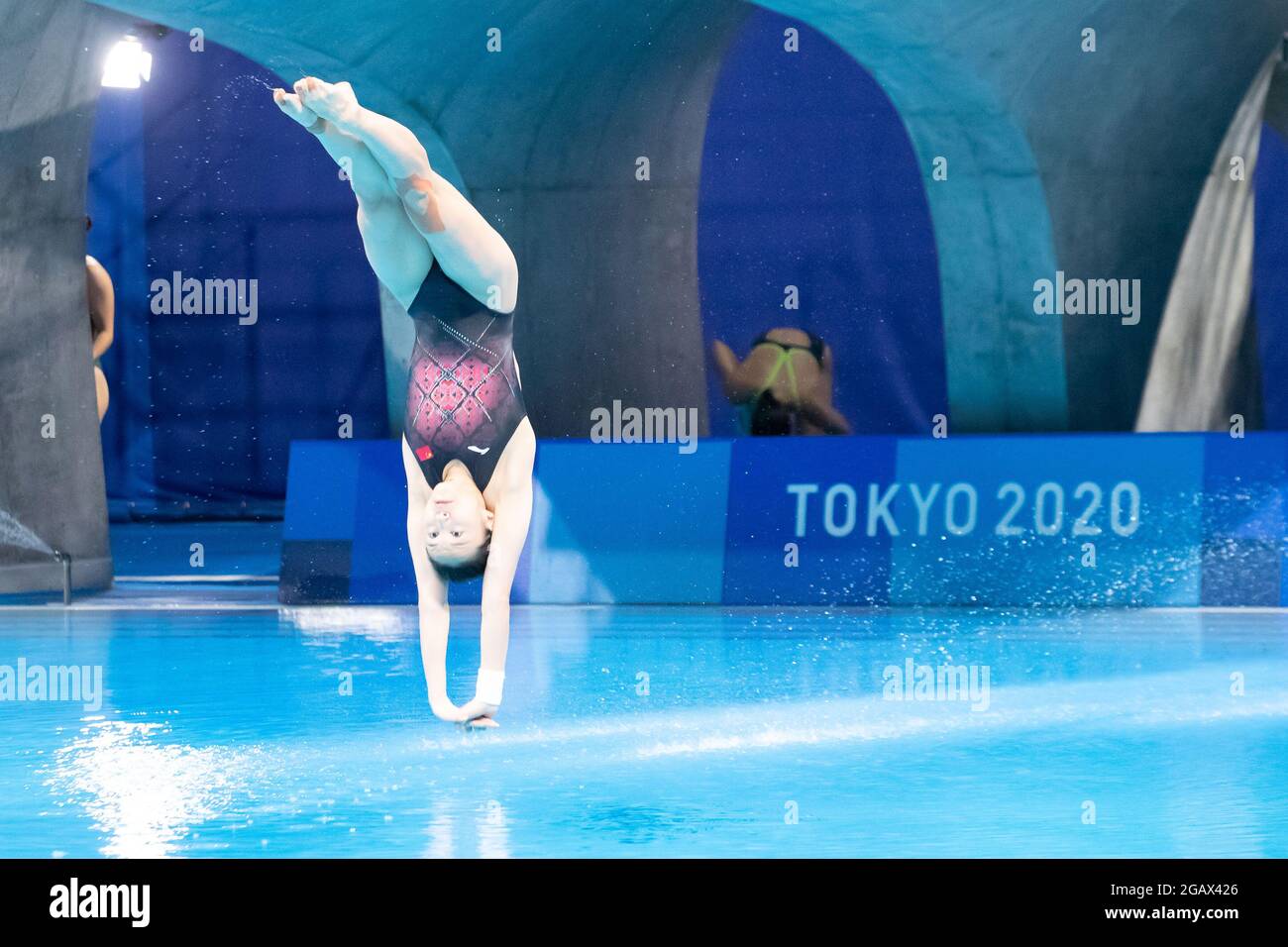 July 31, 2021: Han Wang of China tucks for the dive during the Women's ...