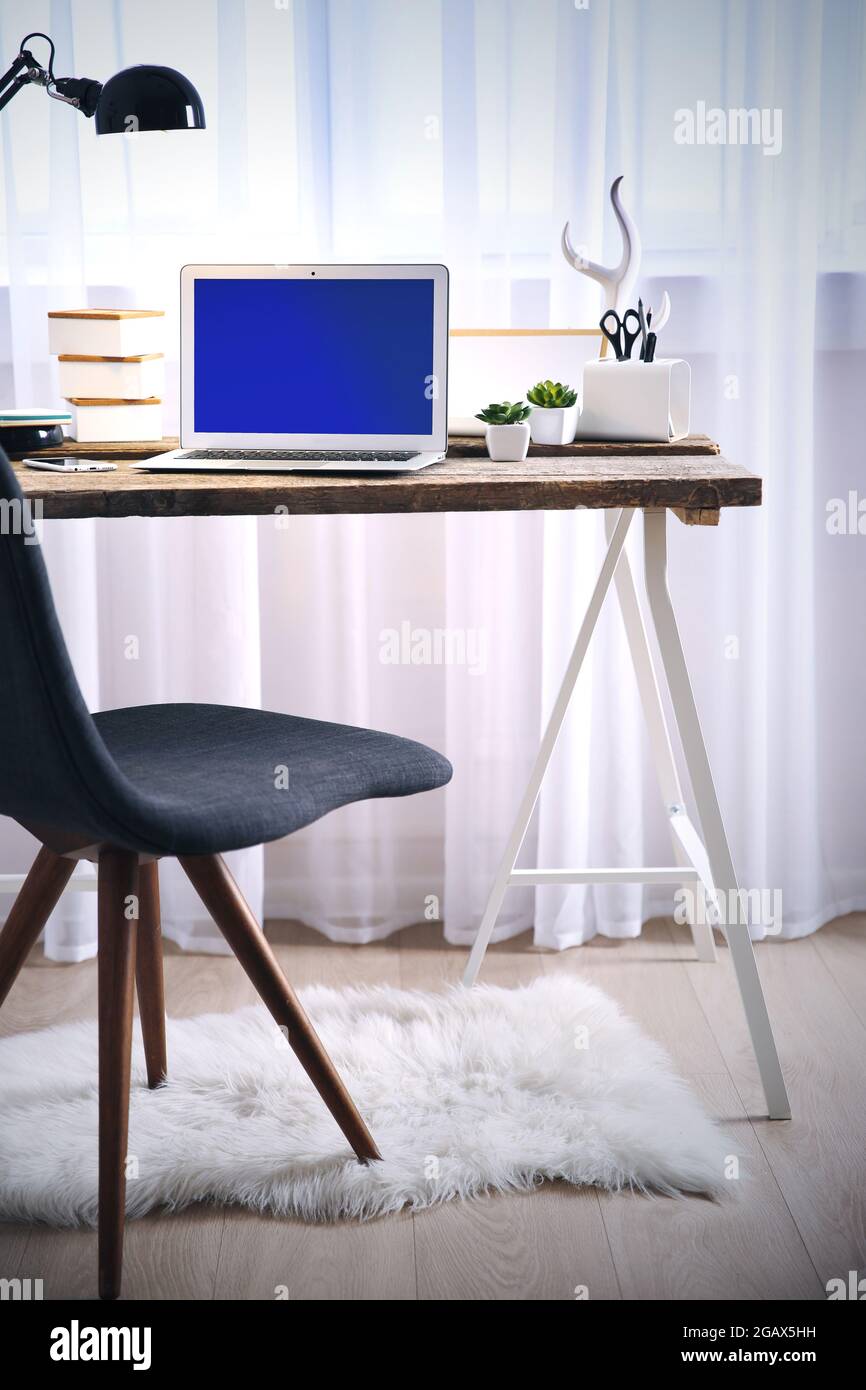Modern workplace on light background Stock Photo - Alamy